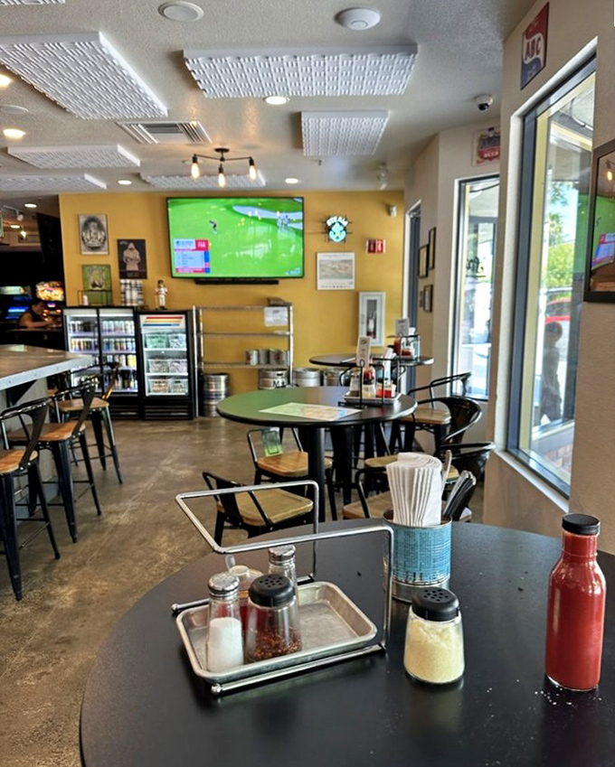 Yellow walls and sports on TV create that perfect neighborhood vibe&mdash;where strangers become friends over shared cheers and cold beers. 