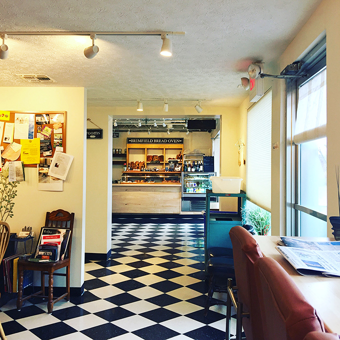 That classic black and white checkered floor isn't just nostalgic&mdash;it's the runway where carb dreams take flight. The bakery's warm interior invites you to linger and indulge.