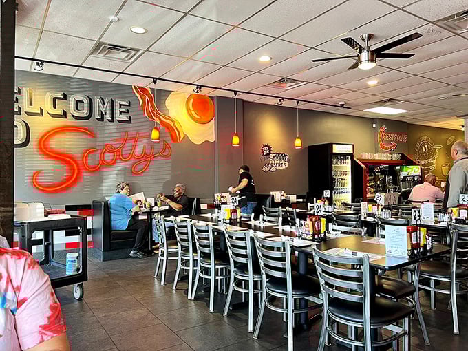 The vibrant welcome mural sets the tone for what's to come – a lively atmosphere where comfort food reigns supreme and conversations flow as freely as the coffee.