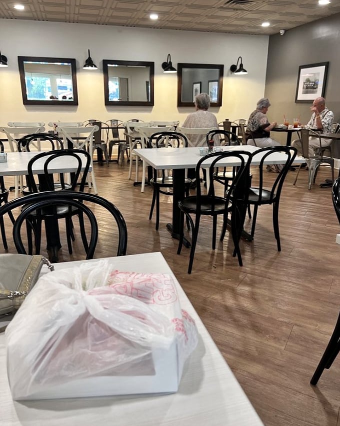 Clean lines, classic bentwood chairs, and warm lighting create the perfect backdrop for culinary magic. Simplicity never looked so inviting.