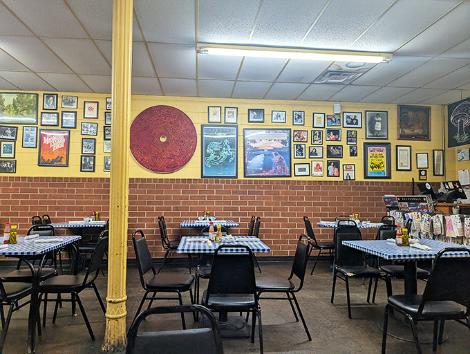 Yellow walls adorned with decades of memories create a living museum where every frame tells a story and every table promises comfort.
