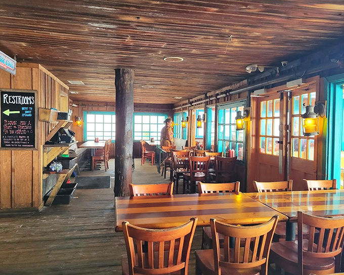 Rustic wooden beams and warm lighting create that "just walked into a friend's beach house" feeling. The perfect backdrop for seafood memories in the making.