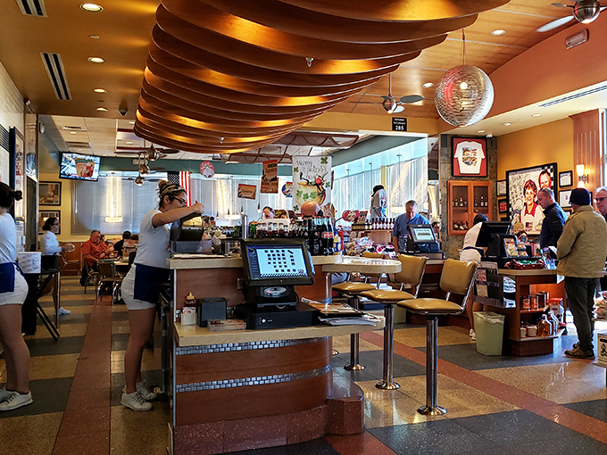 Inside, those magnificent wooden ceiling beams curve overhead like the ribs of a delicious spaceship designed by someone who really understands comfort.