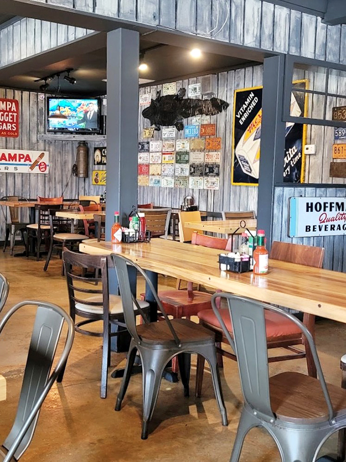 Weathered license plates and vintage memorabilia create the perfect backdrop for serious barbecue conversations and even more serious eating.