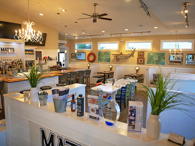 Inside Matt's Fish Camp, nautical charm meets casual elegance. The maritime artwork and elegant chandeliers create the perfect backdrop for seafood indulgence.