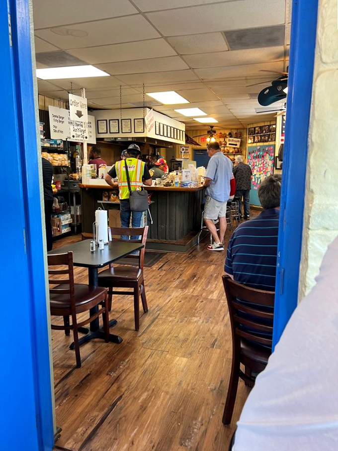 Inside, the worn wooden floors tell stories of countless burger pilgrimages. This isn't dining theater; it's a temple of honest eating.
