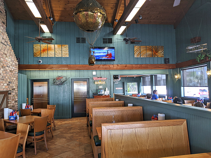 Aqua-blue walls, wooden booths, and that quirky hot air balloon hanging from the ceiling&mdash;this isn't just a restaurant, it's a barbecue sanctuary with personality.
