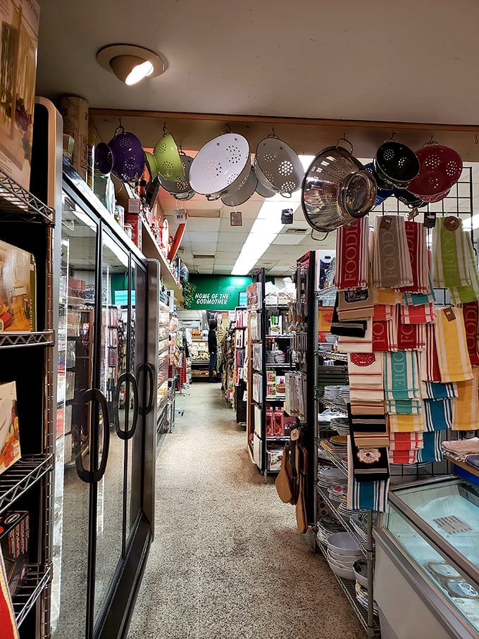 Kitchen tools hanging like delicious wind chimes in a wonderland of Italian imports. This aisle alone is a treasure hunt for home cooks.