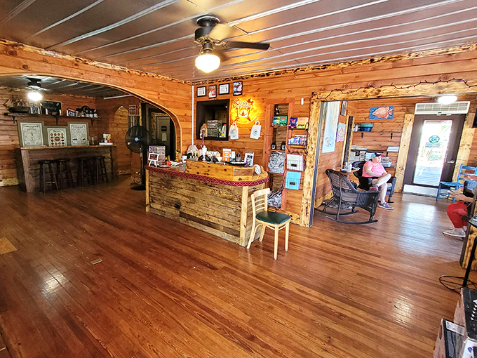Warm wood paneling and rustic charm create the perfect backdrop for seafood feasts. No interior designer needed when you've got this much character.