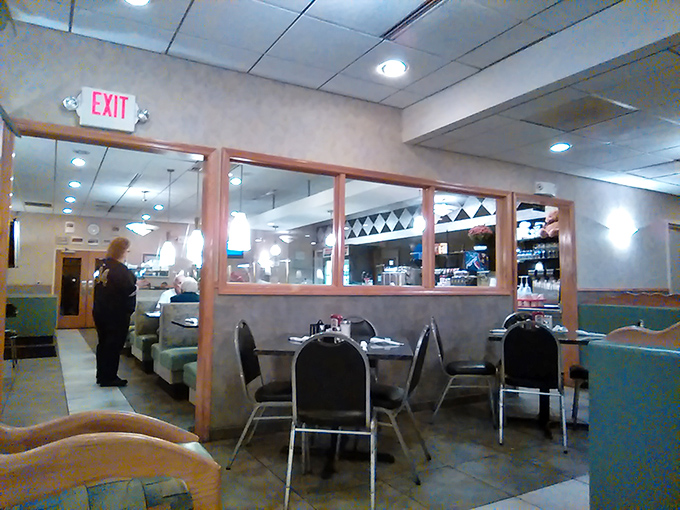 Classic Americana in its purest form—red vinyl stools, checkered counters, and a ceiling that's witnessed decades of late-night confessions and early morning revivals.