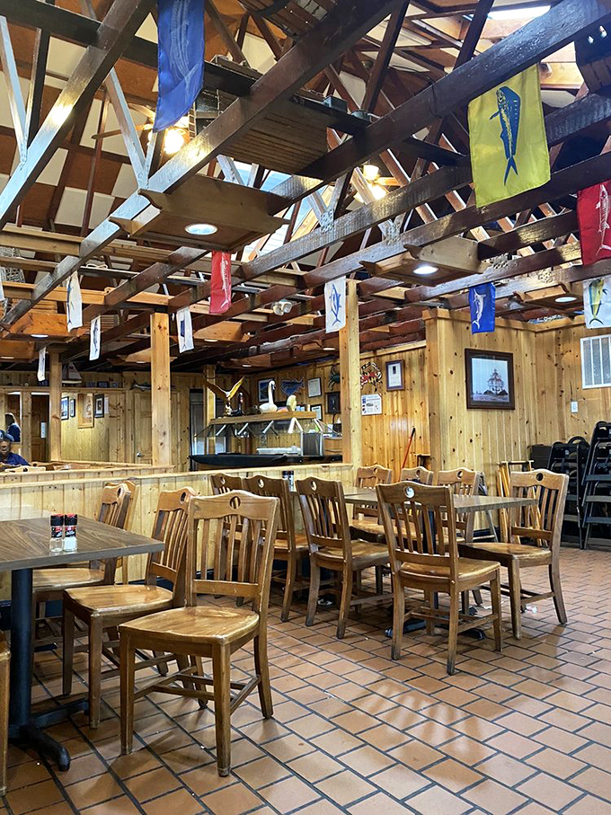 Rustic wooden beams and colorful fish flags create that perfect "yes, they know their seafood" atmosphere that instantly puts you in the mood for crab.