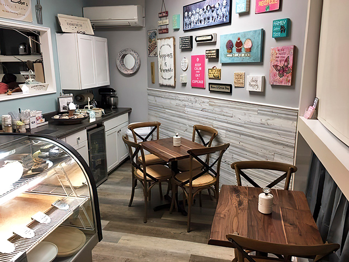 Inside, rustic wooden tables and whimsical wall art create the perfect backdrop for serious pastry contemplation.