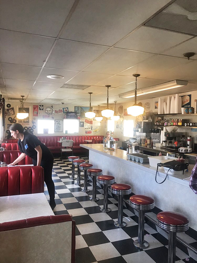 Red vinyl booths, chrome counter stools, and that iconic checkered floor&mdash;this isn't retro-themed, it's authentically preserved Americana.