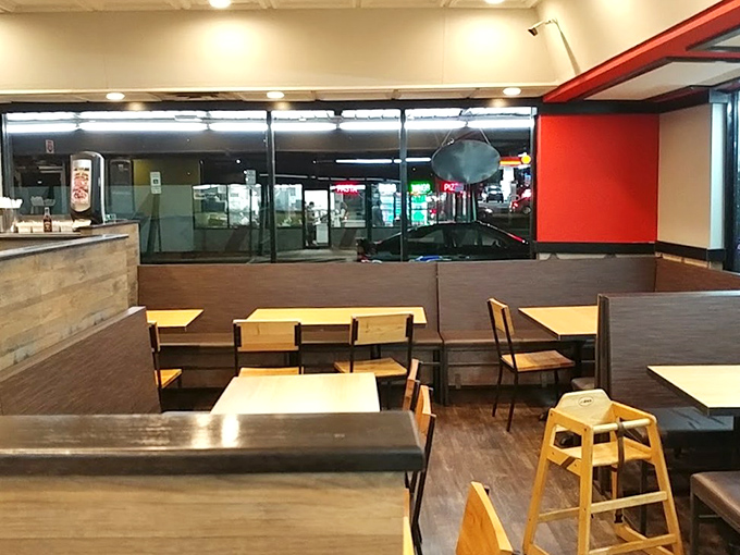 Simple, no-nonsense interior where the focus stays squarely on what matters: the food. Red accents add warmth like the first bite of something delicious.