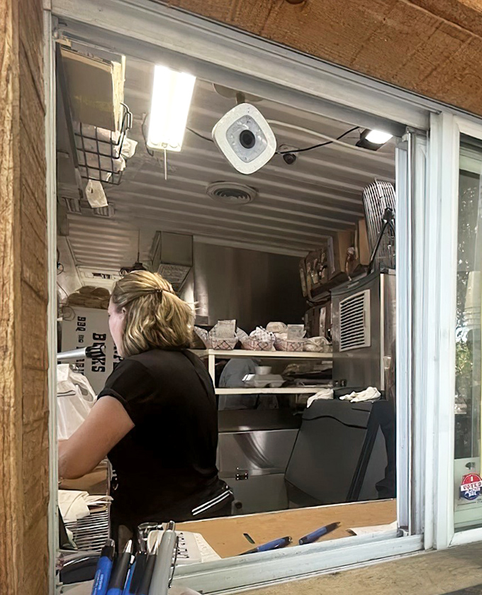 Where BBQ magic happens. This tiny kitchen window is the portal between ordinary hunger and extraordinary satisfaction.