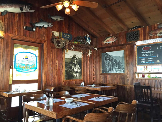Step inside and you're transported to a mariner's dream – wood-paneled walls adorned with fishing trophies and nautical treasures that whisper tales of the deep.
