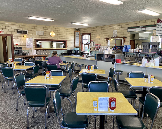 Yellow Formica tables and mint-green chairs create the perfect backdrop for ice cream adventures&mdash;a diner aesthetic that's not retro by design, but authentic by survival.