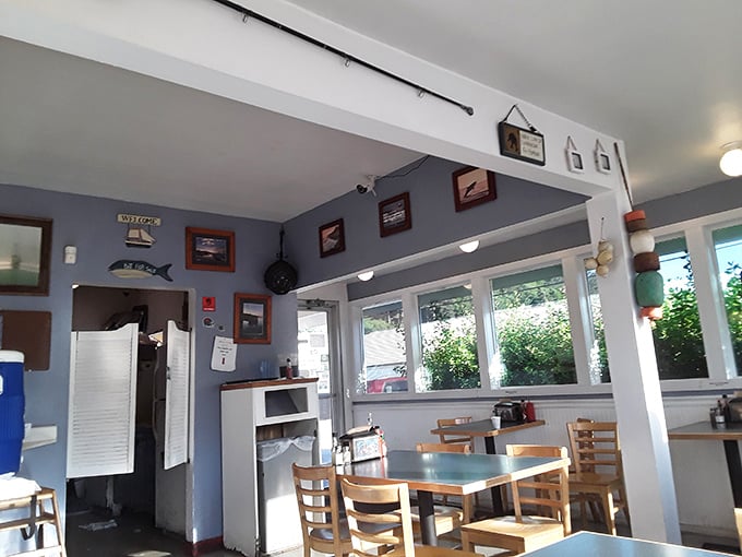 Simple, nautical, perfect. The blue-gray walls and wooden tables create that classic coastal vibe where the focus stays squarely on what matters&mdash;the food.