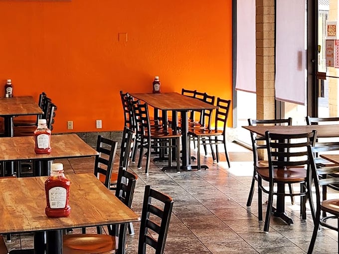 Bright orange walls and simple wooden tables create the perfect backdrop for extraordinary chicken.