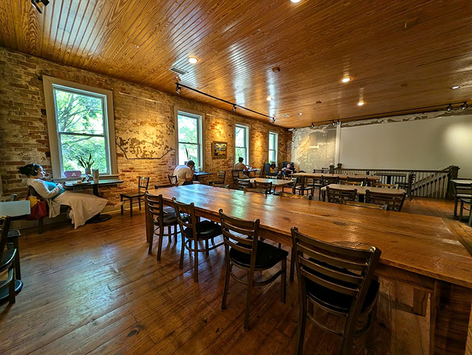 Exposed brick walls, wooden ceiling beams, and tables that have hosted a thousand conversations &ndash; this is where breakfast dreams and caffeine needs unite.