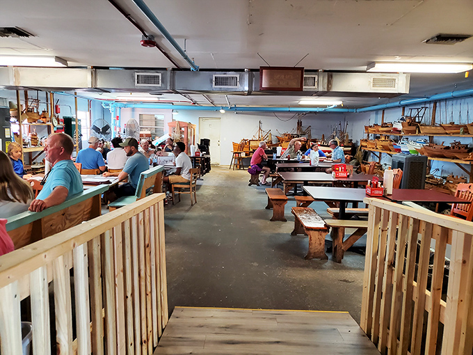 Where nautical charm meets seafood satisfaction. The blue walls and wooden benches create the perfect backdrop for the feast that awaits.