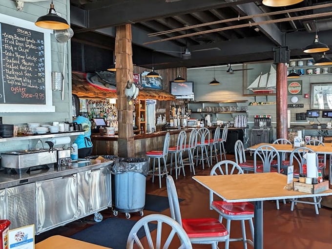 Where nautical meets gastronomical. The rustic interior with its wooden beams and red chairs creates the perfect backdrop for the seafood drama about to unfold.