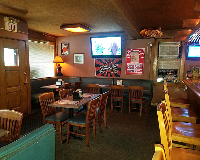 Inside, wooden tables and amber lighting create that perfect "everybody knows your name" vibe where comfort food and conversation flow equally.