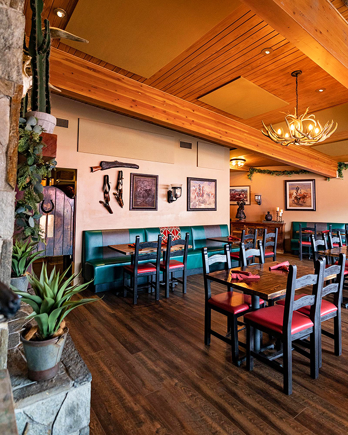 Antler chandeliers, Western artwork, and turquoise booth seating create the perfect atmosphere for enjoying Southwestern cuisine. John Wayne would approve.