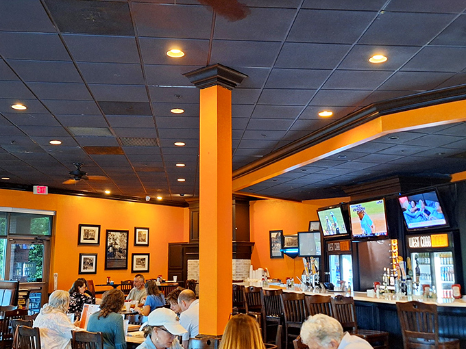 Warm orange walls and wooden accents create that perfect "everybody knows your name" atmosphere where comfort food and conversation flow freely.