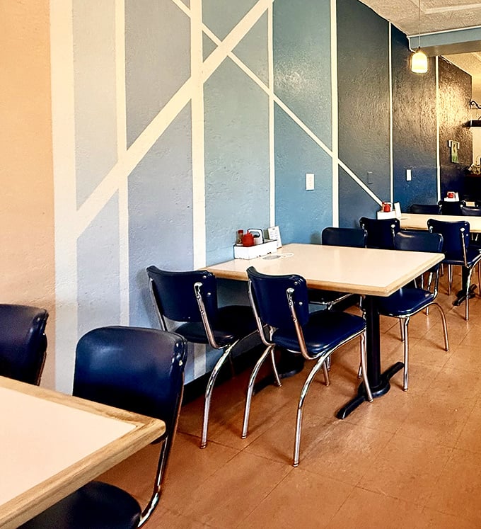 Geometric blue walls and classic chrome seating create that perfect sweet spot between "hip Portland eatery" and "place where your grandpa would feel comfortable ordering seconds."