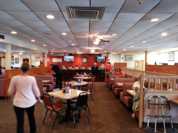 Inside, the classic diner layout invites you to slide into a booth where countless conversations and comfort meals have unfolded over steaming cups of coffee.