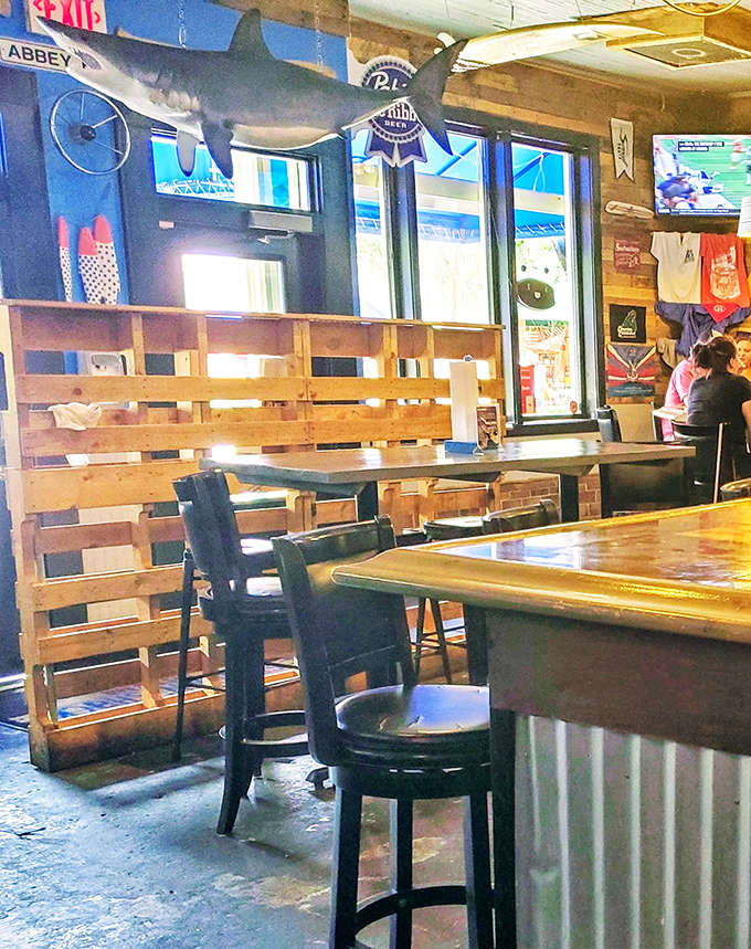 Rustic wooden dividers, a shark keeping watch overhead &ndash; this isn't fancy dining, it's fantastic dining.