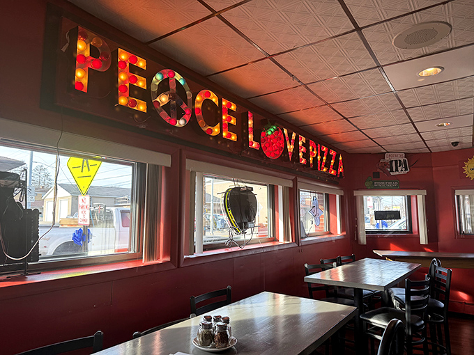 Inside, the illuminated "PEACE LOVE PIZZA" sign isn't just decor&mdash;it's the establishment's unofficial mission statement that's been lighting up taste buds for generations.