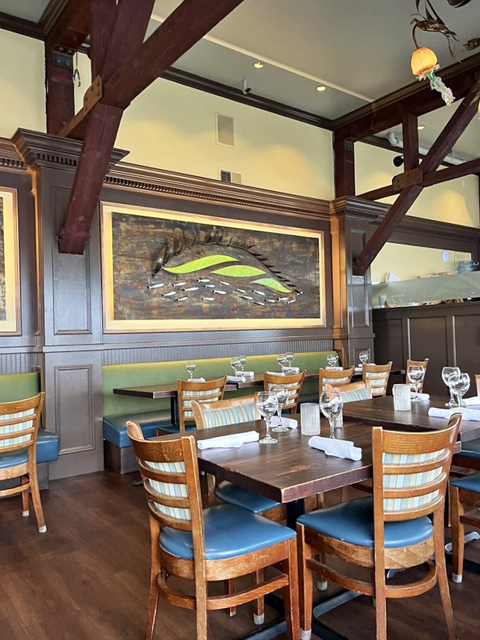 Nautical elegance meets California casual in this dining room where the wooden fish artwork seems to say, "You could've been me, but instead you'll be eating my cousins."
