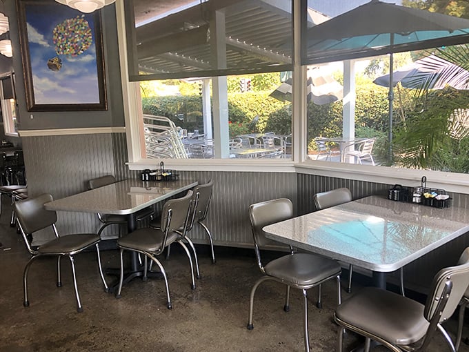 Retro chrome and vinyl seating creates that perfect nostalgic diner atmosphere where calories don't count and coffee refills are infinite.