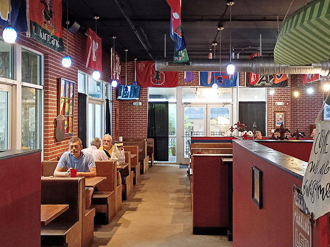 Inside, wooden booths and colorful college flags create that perfect "come as you are" atmosphere where both date nights and casual lunches feel equally at home.