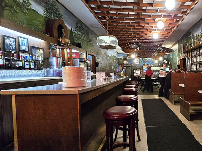 The bar area stretches into infinity, where wood-latticed ceilings and murals of the Italian countryside transport you to a simpler, saucier time.