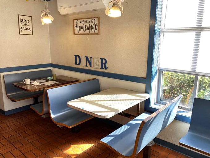 Sunlight dances across classic blue vinyl booths where countless coffee cups have been refilled and breakfast dreams fulfilled. "Happiness is Homemade" indeed.