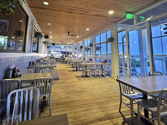 Wooden floors, airy ceilings, and those windows! The dining room offers panoramic water views that compete for attention with what's on your plate.