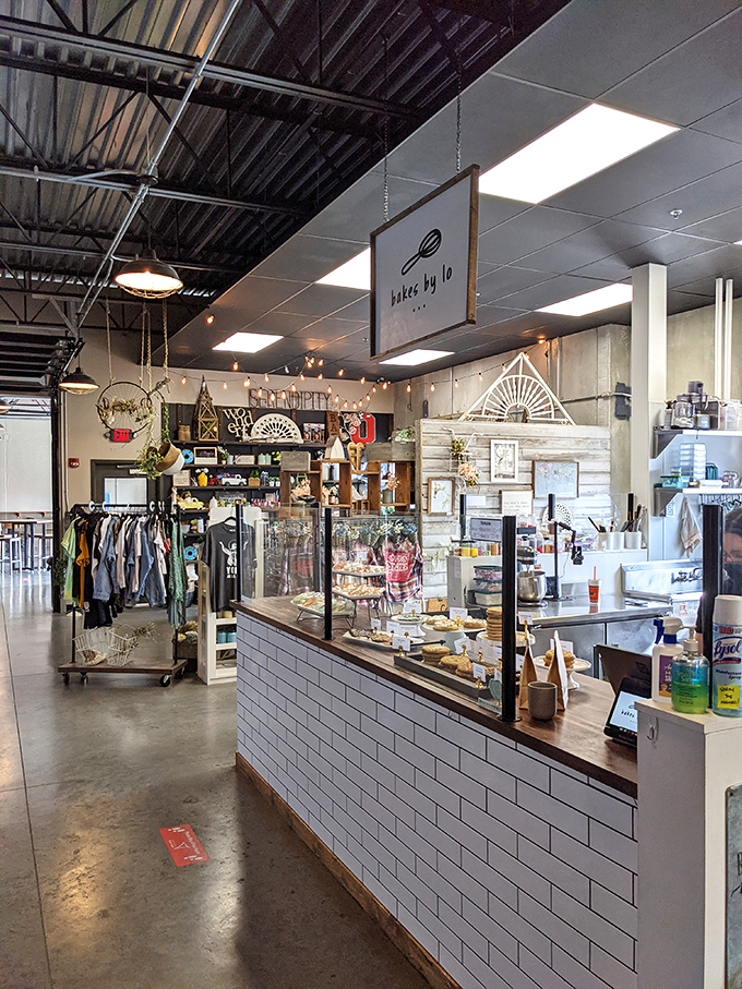 Industrial-chic meets cozy comfort in this thoughtfully designed space where white subway tile and wooden countertops create the perfect backdrop for pastry perfection.
