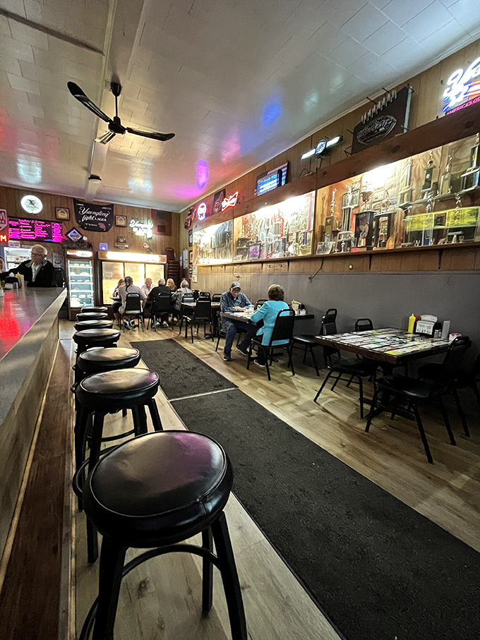 Inside, wood paneling and neon signs create the perfect time capsule &ndash; where conversations flow as freely as the cold beer.