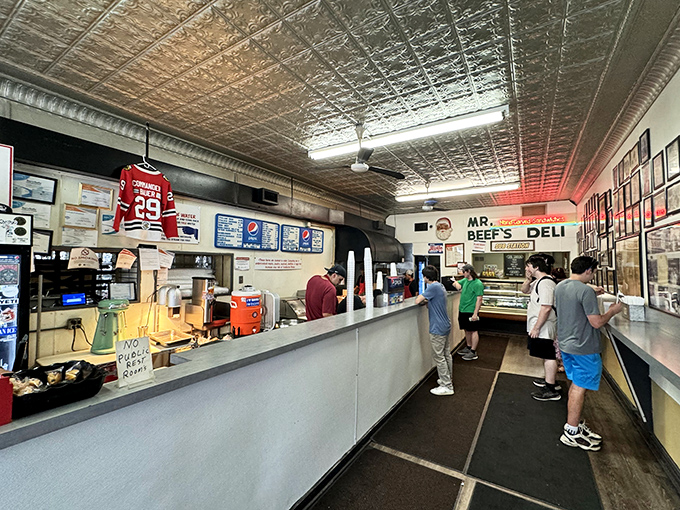 The no-nonsense interior speaks volumes: pressed tin ceiling, Blackhawks jersey, and a line of hungry patrons who know greatness doesn't need fancy trimmings.