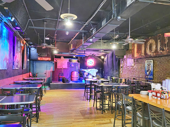 Purple neon bathes the dining room in a glow that says, "The blues live here, and they're delicious."