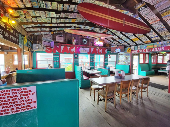 License plates from across America create a colorful mosaic overhead, each one representing a visitor who left a piece of themselves at this quirky Florida gem.