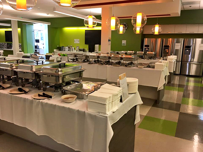 The buffet setup at UlavacharU is a masterclass in temptation &ndash; bright green walls and gleaming serving stations promising flavor adventures.