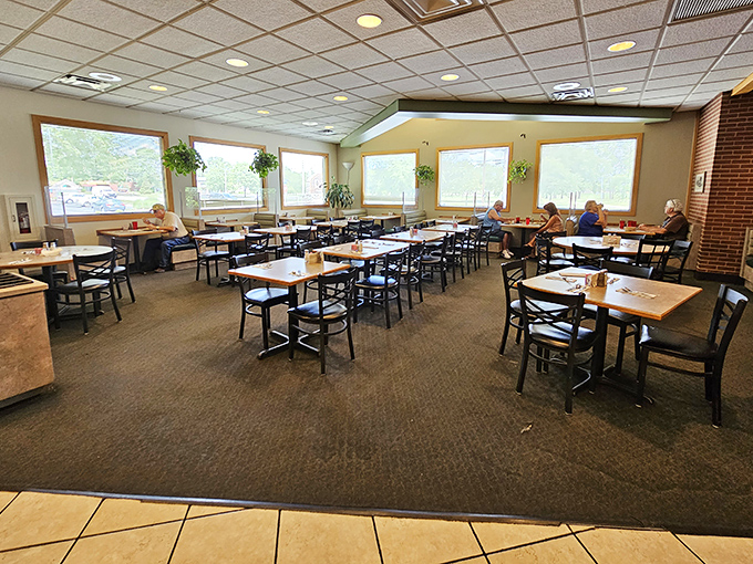Sunlight streams through large windows, illuminating a dining room where conversations flow as freely as the coffee. No designer needed—just honest comfort.