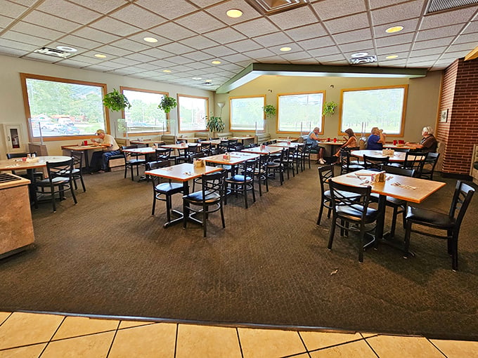 Sunlight streams through large windows, illuminating a dining room where conversations flow as freely as the coffee. No designer needed&mdash;just honest comfort.