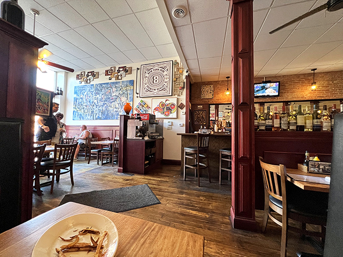 Step inside and the warm wooden floors, exposed brick, and local artwork immediately tell you this isn't your average small-town eatery.