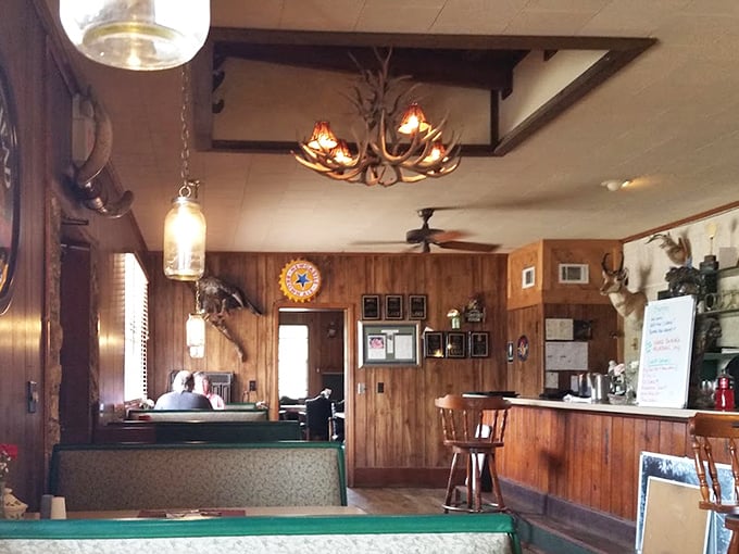 Step inside and you're greeted by wood-paneled walls, antler chandeliers, and the unmistakable feeling that memorable meals happen here regularly.