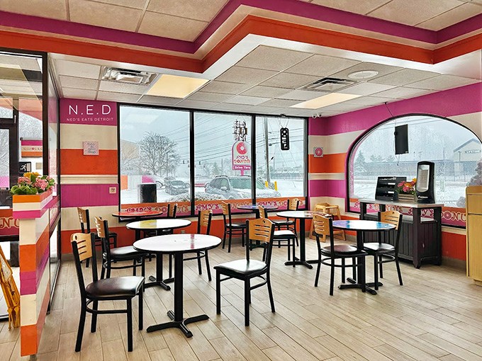 Inside, the vibrant pink and orange walls energize you before you've consumed a single calorie. It's like they've infused the very air with donut essence.